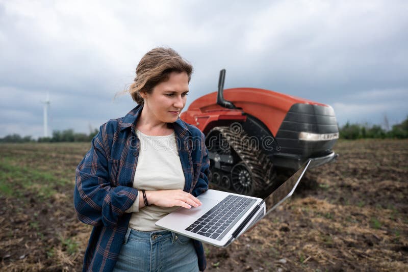 Farmer with Digital Tablet Controls an Autonomous Tractor Stock Photo ...