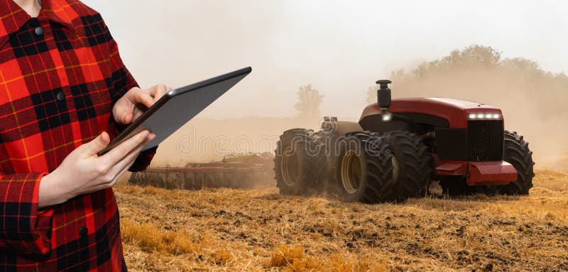 Farmer with Digital Tablet Controls an Autonomous Tractor on a Smart ...