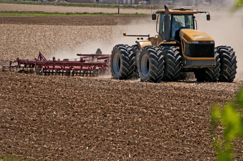 Farmer Discing His Field stock image. Image of meadow - 23633155