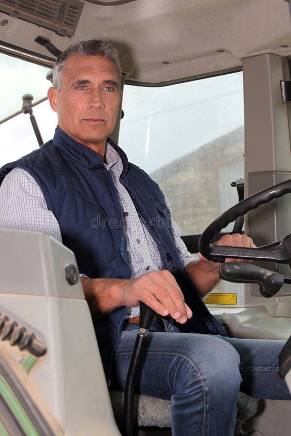 A man driving a tractor stock image. Image of handling - 21257545