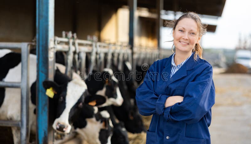 Farmer Engaged in Breeding of Cows Posing in Cowshed Stock Photo ... Farmer Engaged in Breeding of Cows Posing in Cowshed Stock Photo ...