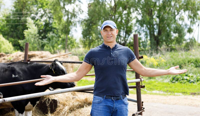 Farmer at Farm with Dairy Cows Stock Photo - Image of country ...