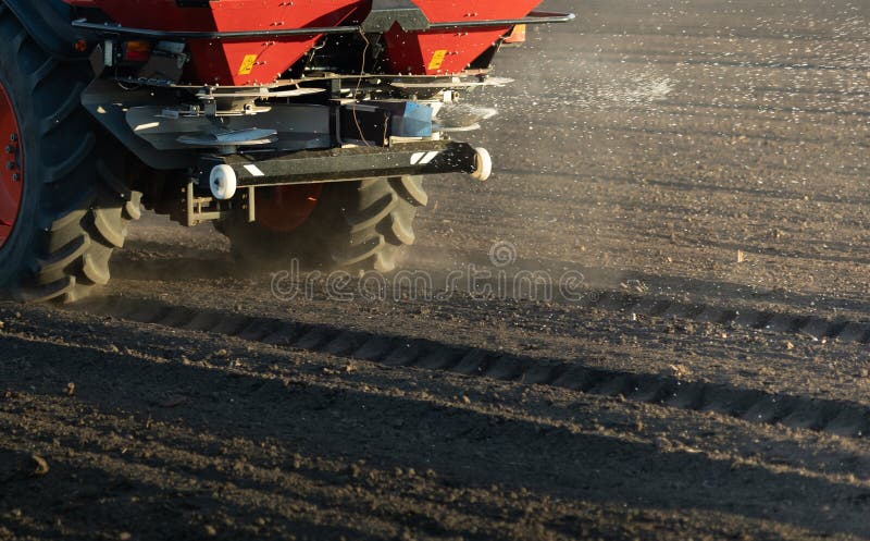 Farmer Fertilizing Arable Land with Nitrogen Fertilizer Stock Image ...