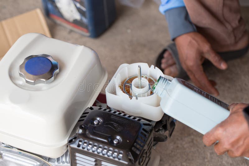 Farmer Fill Engine Oil into Oil Filter of Water Pump Stock Photo ...