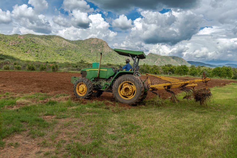 Farmer with Green Tractor Prepares Field for Sowing Editorial Stock ...