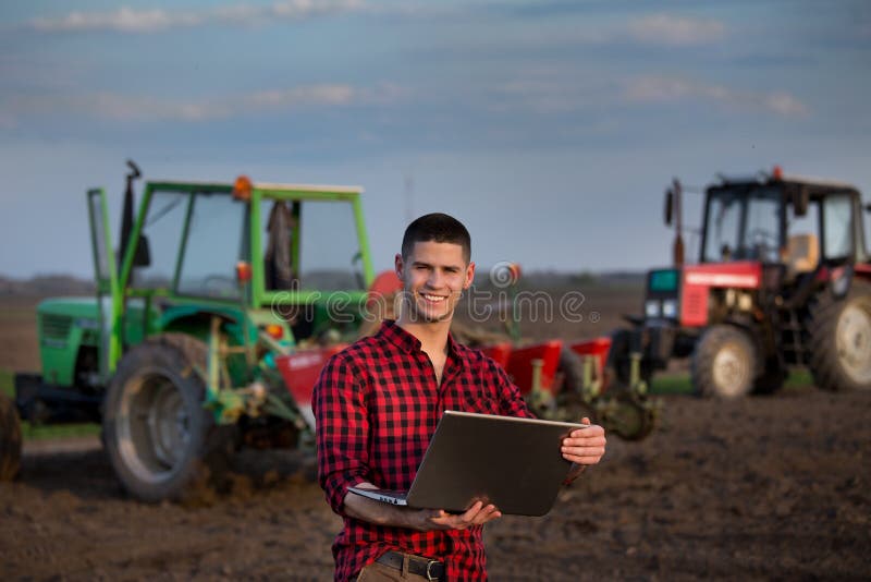 Farmer with Laptop and Tractors Stock Image - Image of agribusiness ...