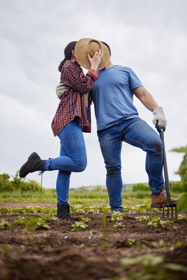Farmer, Love and Couple Kiss Hiding with a Hat on Agriculture ... Farmer, Love and Couple Kiss Hiding with a Hat on Agriculture ...