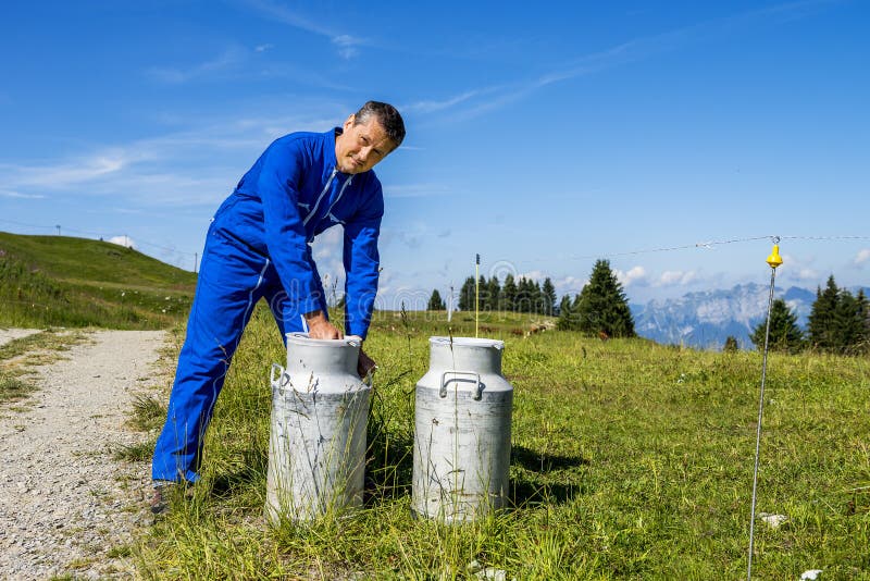 Farmer with Milk Containers Stock Photo - Image of herdsman, milk: 33087208
