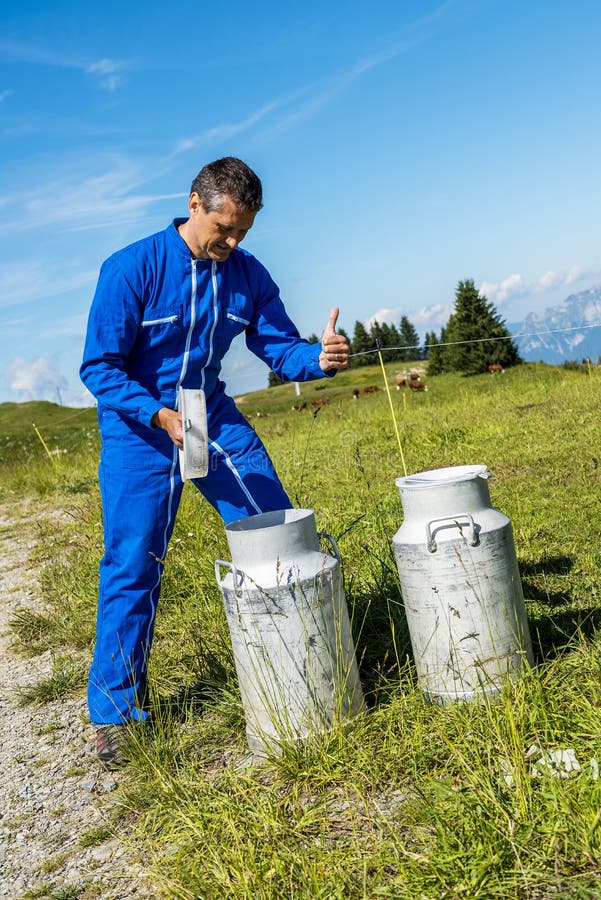 Farmer with Milk Containers Stock Photo - Image of arms, standing: 34618954