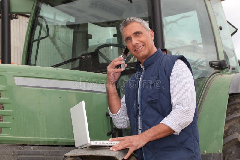Farmer near a tractor stock photo. Image of expert, life - 36891436
