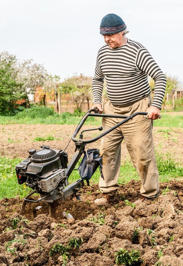 Farmer plowing the field. stock photo. Image of farming - 44107962