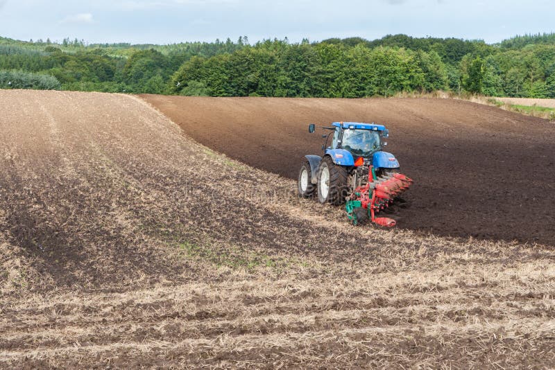 Farmer Plowing Field with Tractor Stock Photo - Image of land, tractor ...