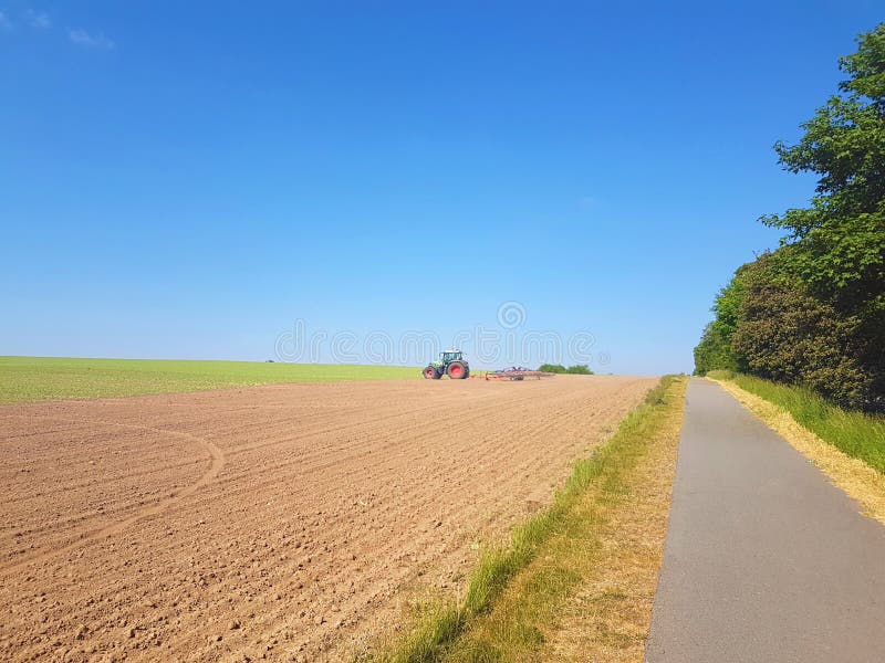 Farmer is Plowing a Field with Tractor Stock Image - Image of autumn ...