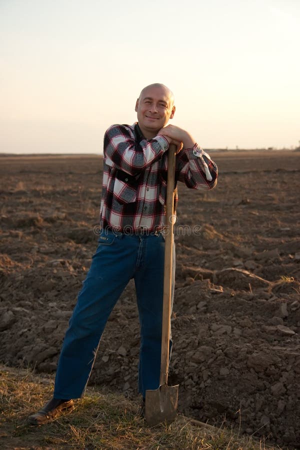 Farmer holding pitchfork stock photo. Image of angry - 15677894