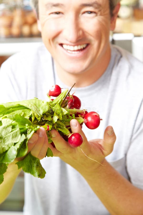 Farmer with Radish in Farm Shop Stock Photo - Image of pensioner, farm ...