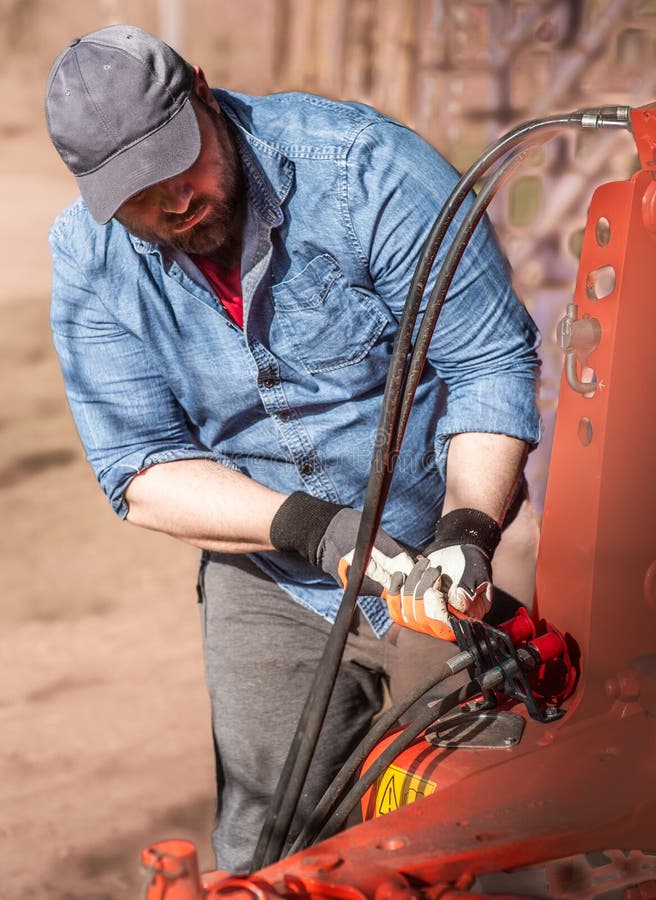 The Farmer Repairs Agricultural Machines Stock Photo - Image of service ...