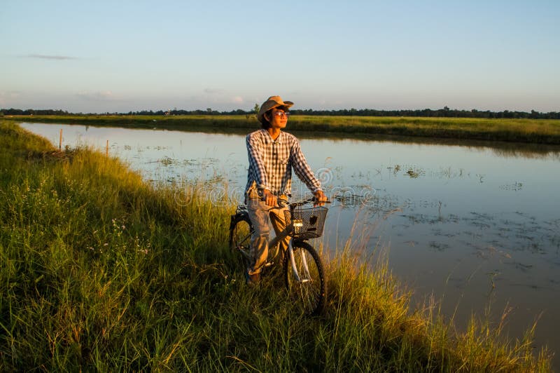 Farmer riding bicycle stock image. Image of hobby, dirt - 35137909