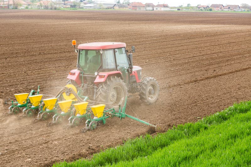 Farmer Seeding, Sowing Crops at Field Stock Photo - Image of machine ... Farmer Seeding, Sowing Crops at Field Stock Photo - Image of machine ...