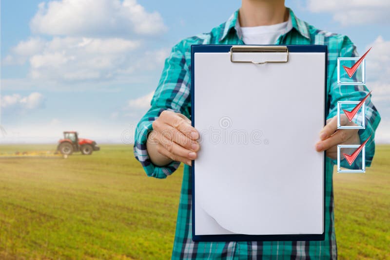 Farmer shows check list . stock image. Image of business - 115249215
