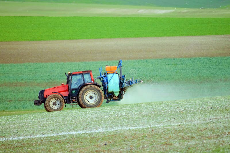 Farmer Spraying His Fields for Fertilizer or Pesticides Stock Photo ...