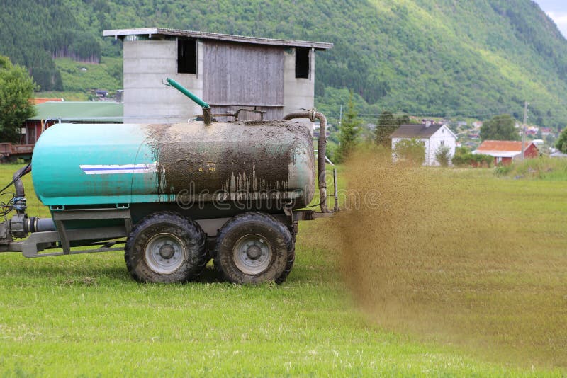 Farmer Spreading Liquid Manure Stock Photo - Image of nutrients, modern ...