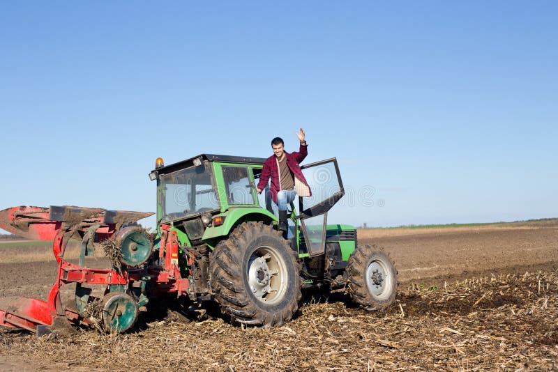 Farmer Standing on the Tractor Stock Photo - Image of machine ...