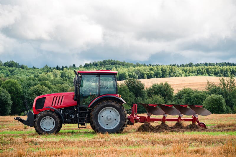 Farmer in Tractor Plowing the Land in Autumn Stock Image - Image of ...