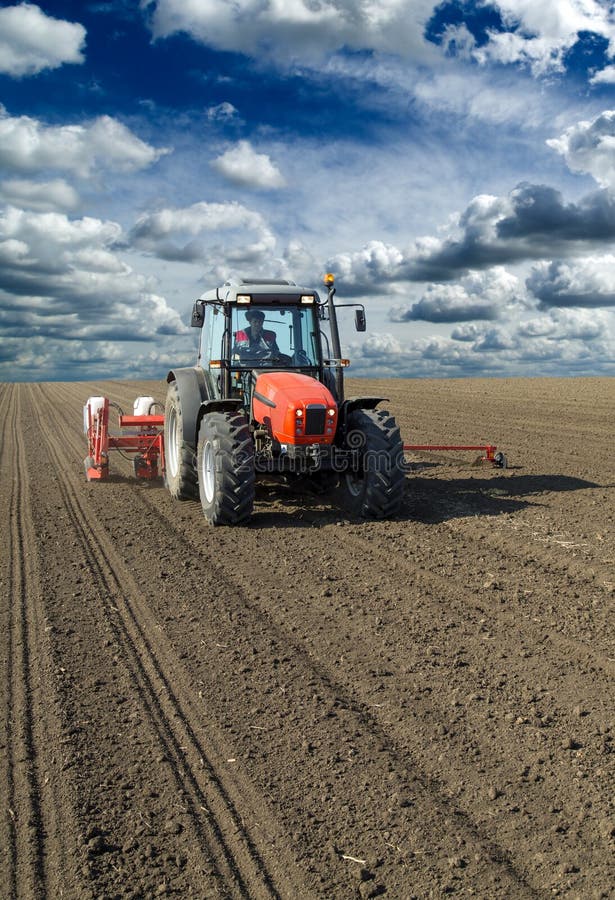 Farmer in Tractor Sowing Corn Maize Crops. Stock Photo - Image of ...