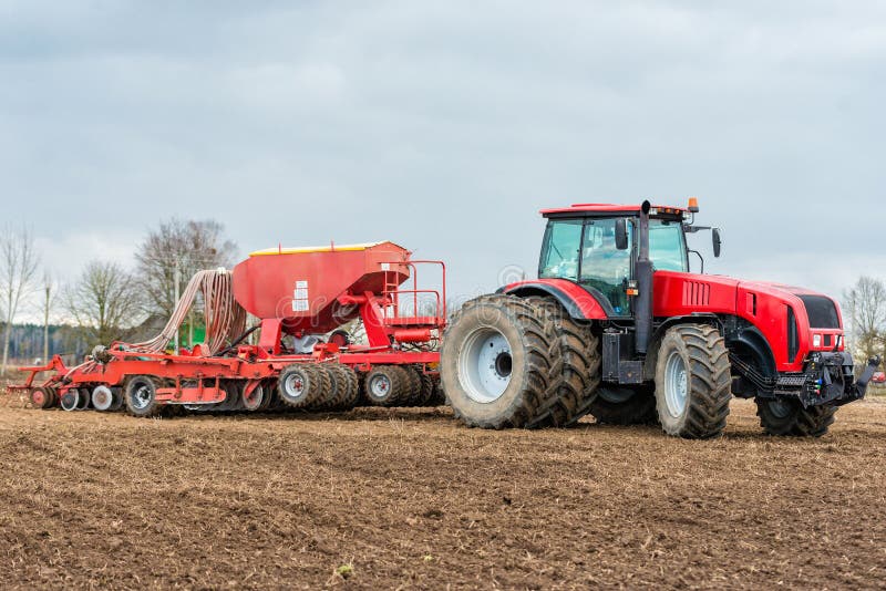 Farmer Tractor Working in the Field. Spring Time for Sowing Stock Photo ...