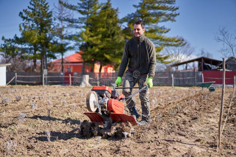 Farmer Weeding the Field with a Tiller Stock Image - Image of growing ...