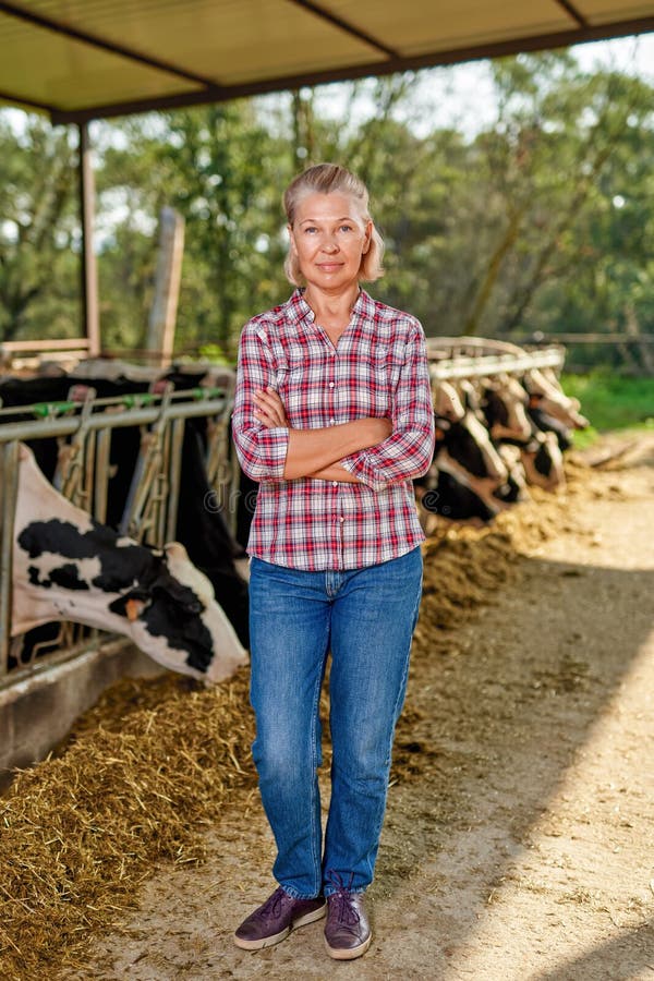 Farmer Woman is Working on Farm with Dairy Cows Stock Photo - Image of ...