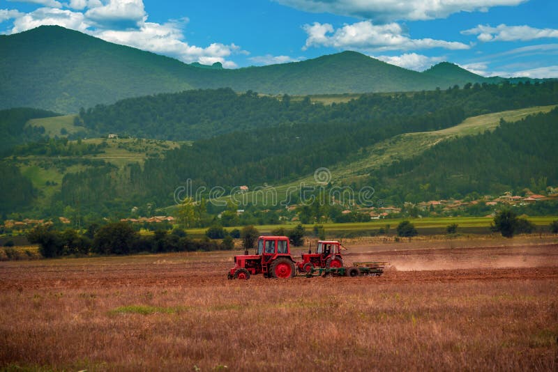 Farmer Working the Fields with Tractor and Plow Stock Image - Image of ...