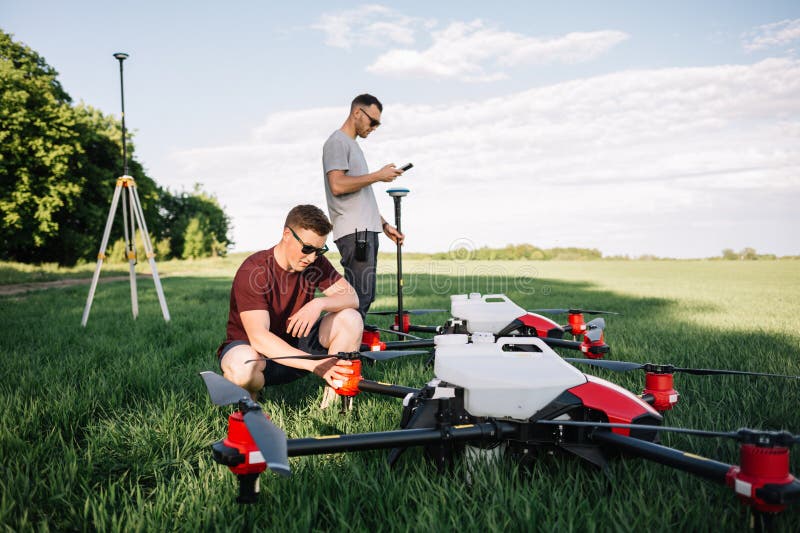 Farmers Set Up Agricultural Drones before Cultivating the Fields. Stock ...