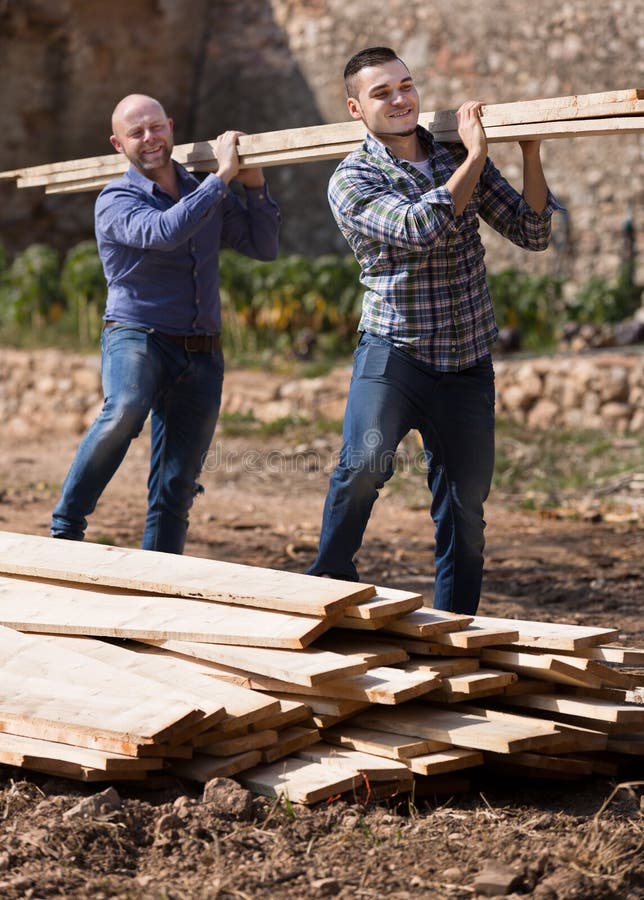 Carpenters Carrying Wooden Planks Stock Image - Image of builder ...