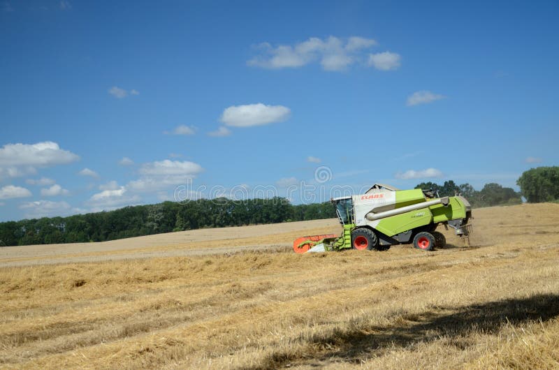 Farming in Poland, Harvester at Work Editorial Stock Image - Image of ...