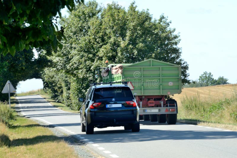 Farming in Poland, Car Passing Tractor Editorial Photo - Image of ...
