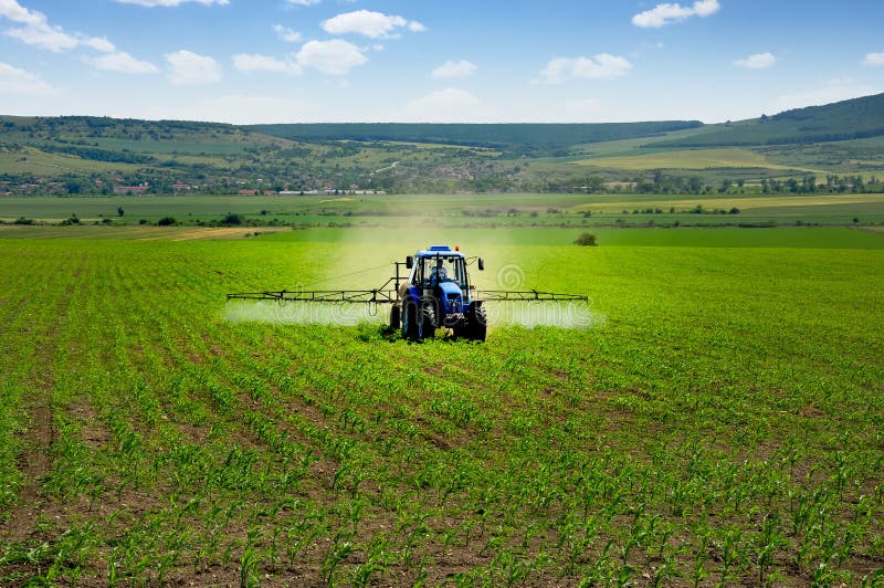 Aerial View of Farming Tractor Plowing and Spraying on Field Stock ...