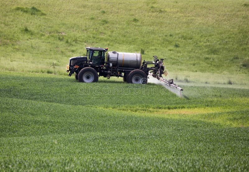 Farming tractor spraying stock photo. Image of outdoors - 119189920
