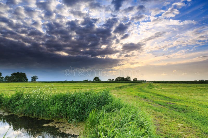 Farmland Landscape with Dark Clouds Stock Image - Image of farming ...