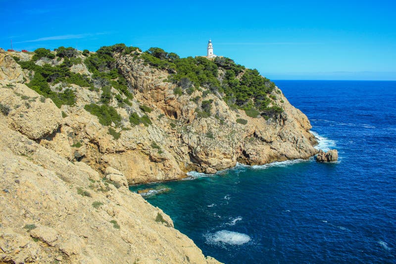 Faro De Capdepera Lighthouse on Top of Cliffs in Cala Gat Near Cala ...