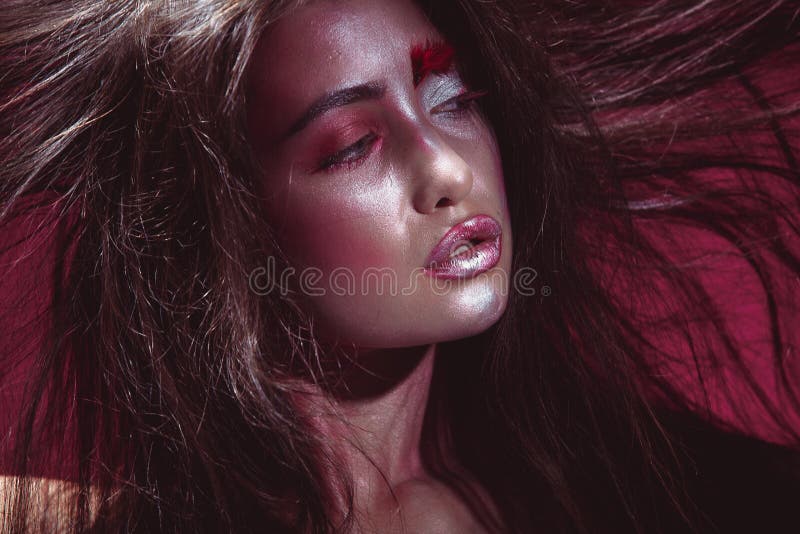 Fashion Portrait Of A Dark Skinned Girl With Silver Foil Make Up
