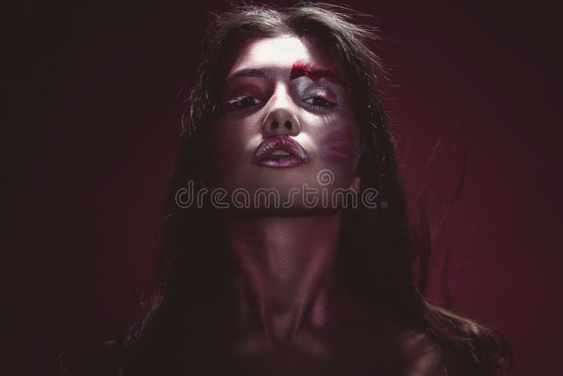 Fashion Portrait Of A Dark Skinned Girl With Silver Foil Make Up