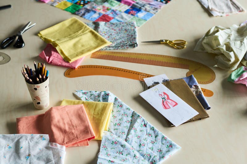 Fashion Designer Creating Dress Sketch with Fabric Samples and Drawing ...