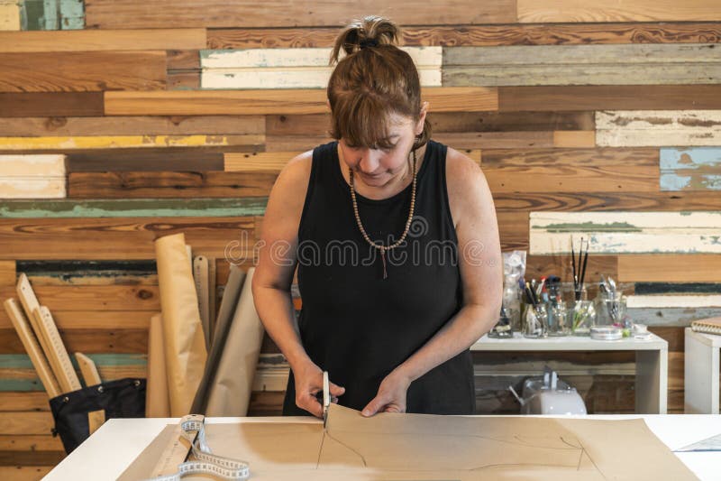 Fashion Designer Cutting Clothes Patterns at Her Studio Stock Photo ...