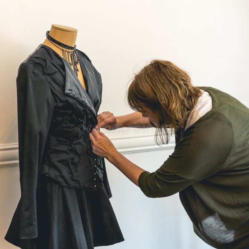 Fashion Designer Dressing a Mannequin with Black Clothes Stock Photo ...