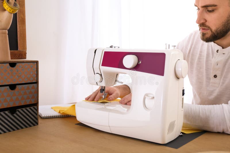 Fashion Designer Sewing New Clothes with Machine in Studio Stock Image ...
