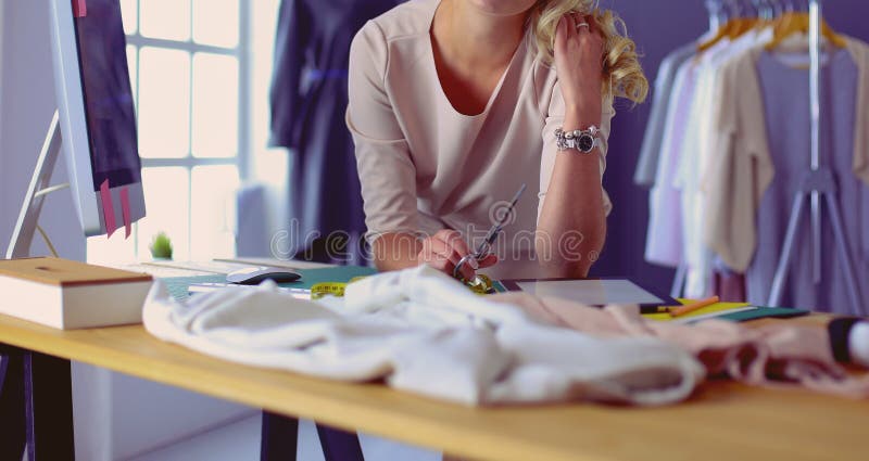 Fashion Designer Woman Working on Her Designs in the Studio. Stock ...