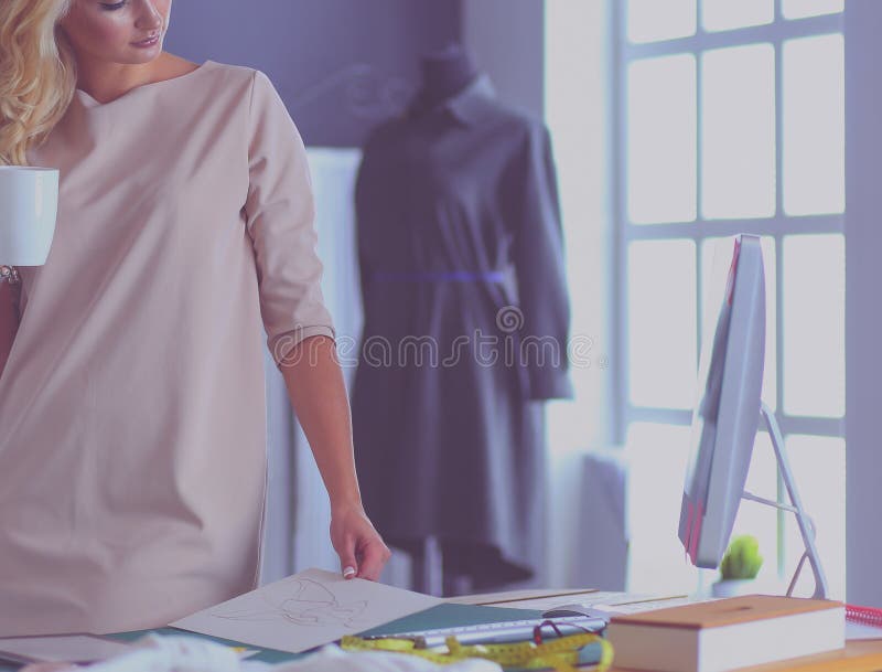 Fashion Designer Woman Working on Her Designs in the Studio. Stock ...