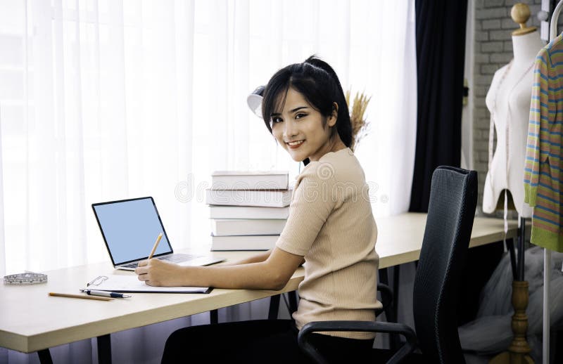 Fashion Designer are Working in Studio Process of Creating New Clothes ...