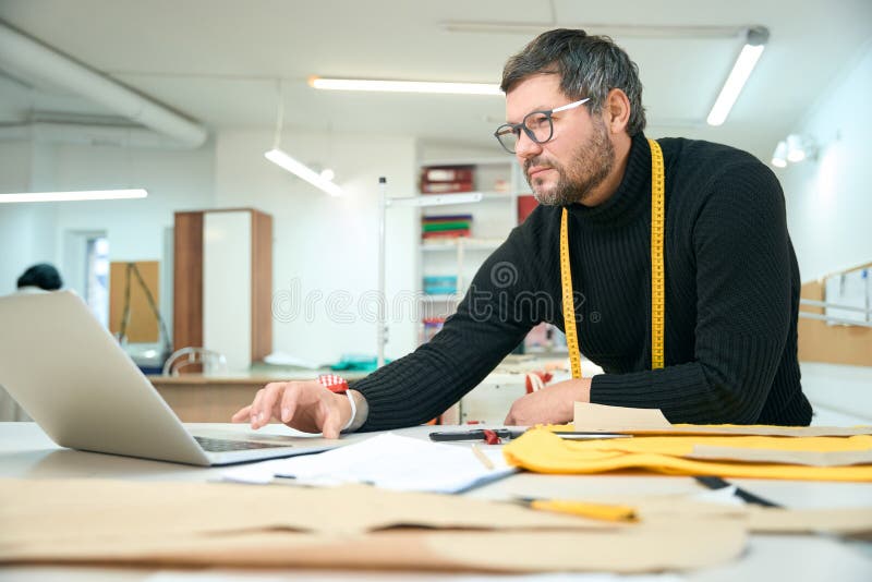 Fashion Designer Works with Patterns at a Cutting Table Stock Image ...